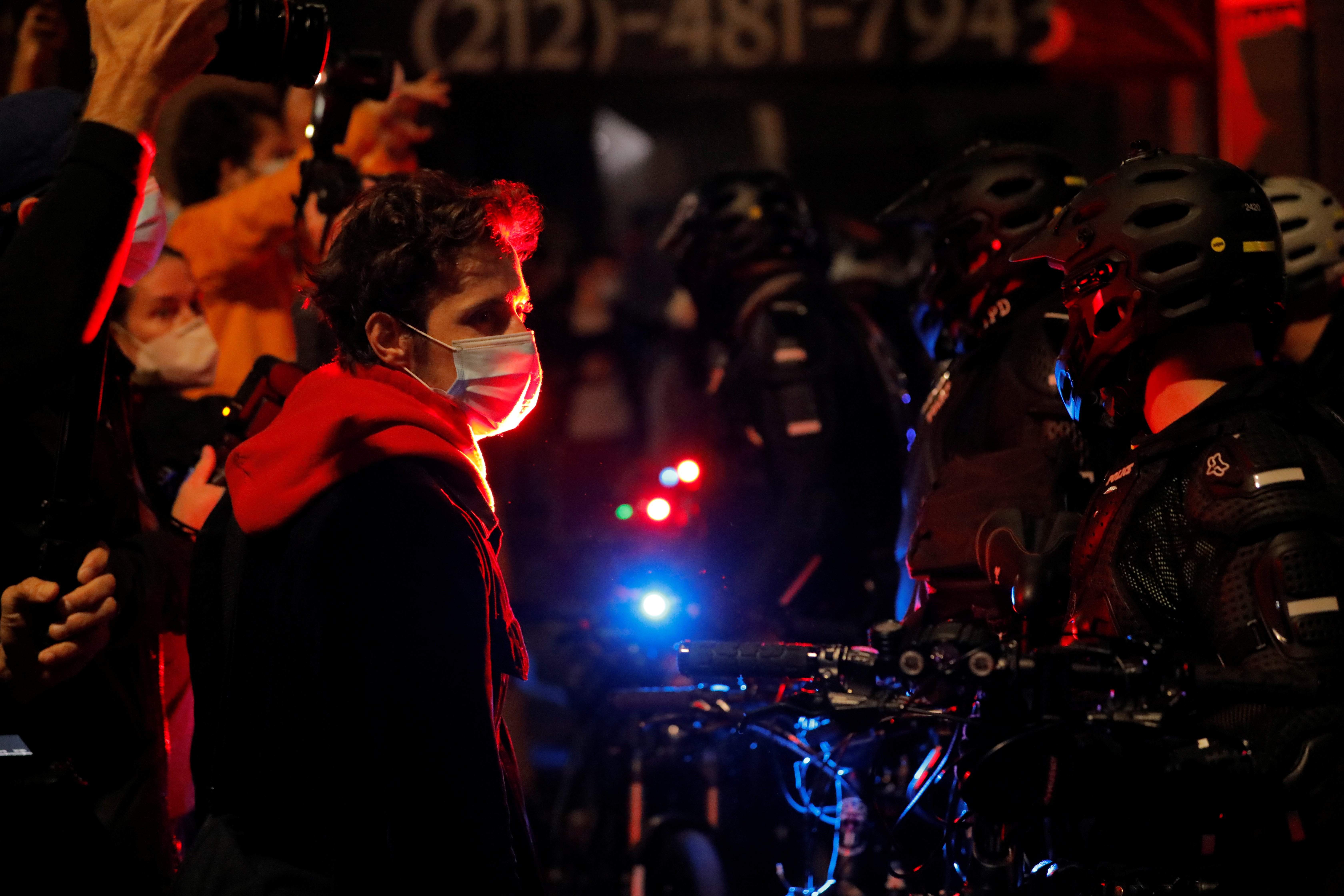 Police shove Wall Street Journal reporter during post-election protest ...