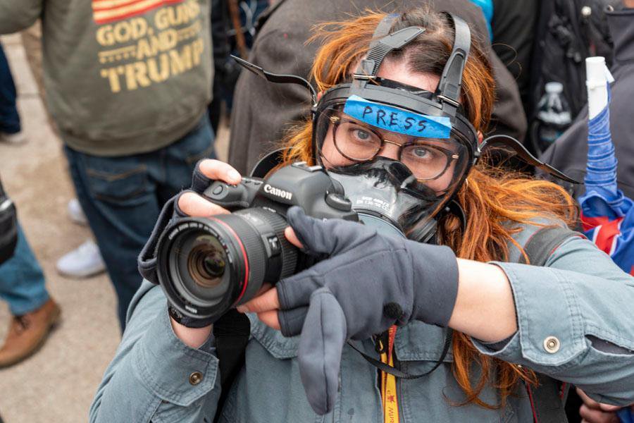 Freelance photojournalist struck multiple times with projectiles during ...